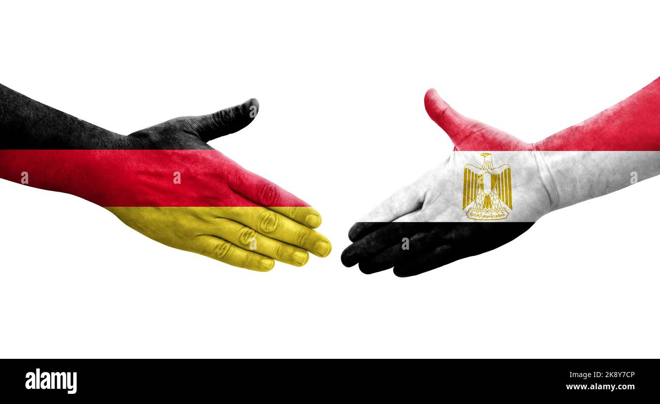 Handshake between Egypt and Germany flags painted on hands, isolated ...