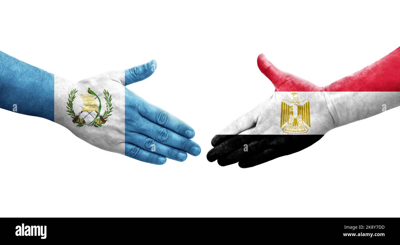 Handshake between Egypt and Guatemala flags painted on hands, isolated ...