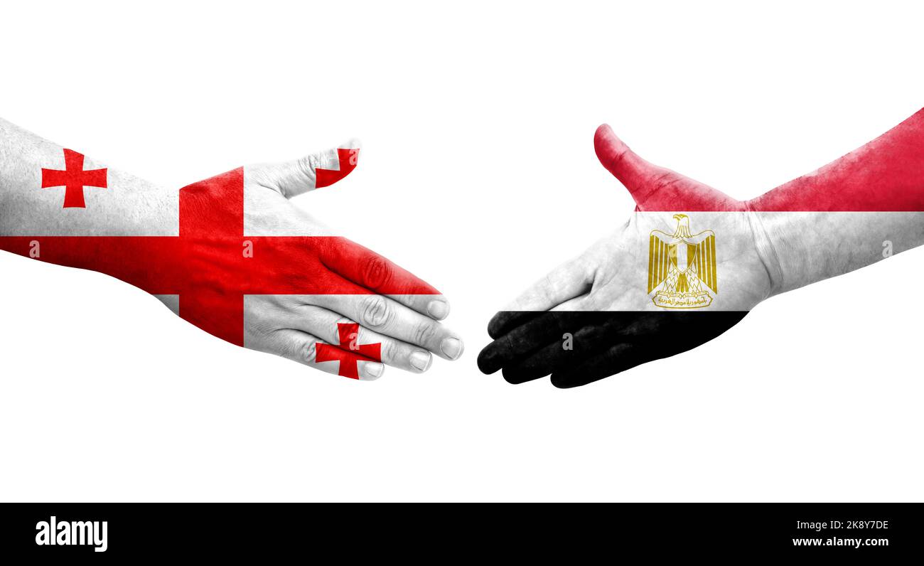 Handshake between Egypt and Georgia flags painted on hands, isolated ...