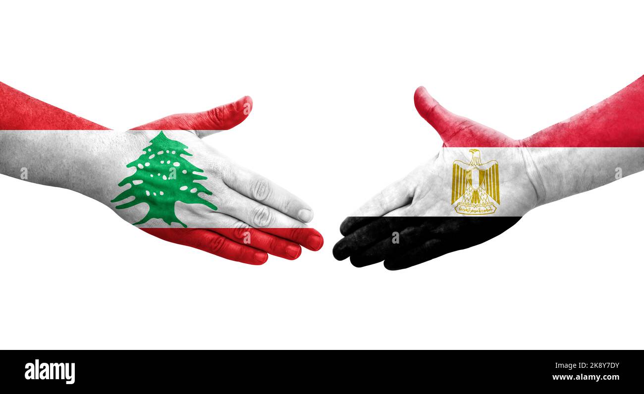 Handshake between Egypt and Lebanon flags painted on hands, isolated ...