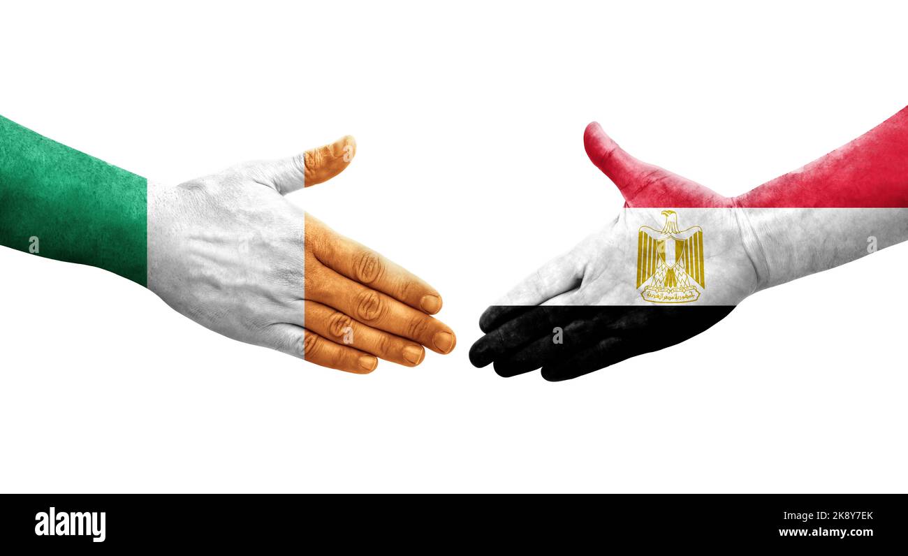 Handshake between Egypt and Ireland flags painted on hands, isolated ...