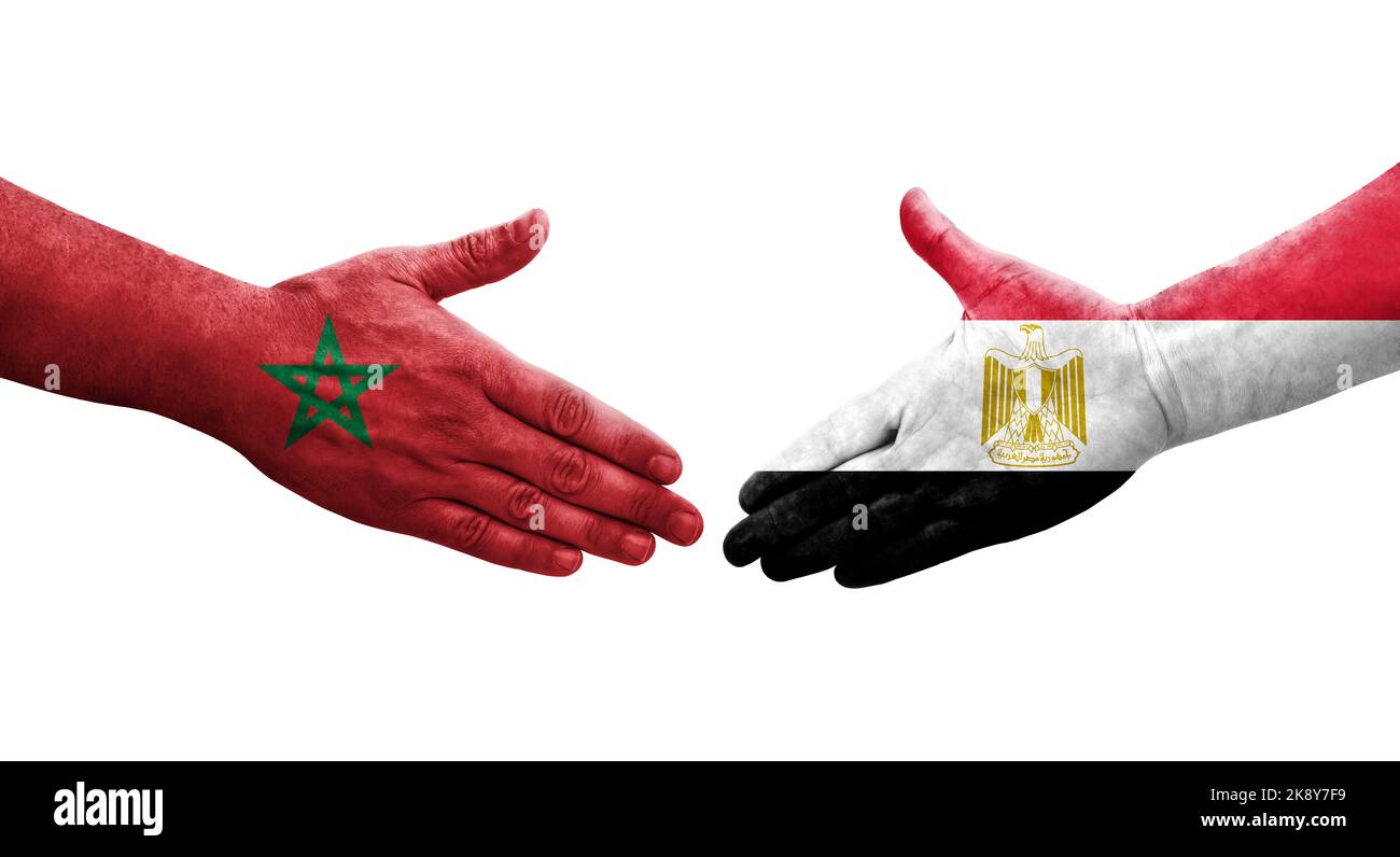 Handshake between Egypt and Morocco flags painted on hands, isolated ...