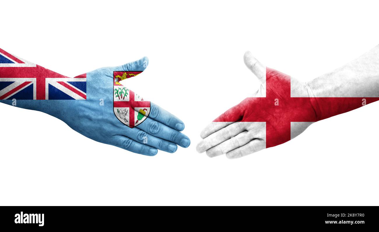 Handshake between England and Fiji flags painted on hands, isolated ...