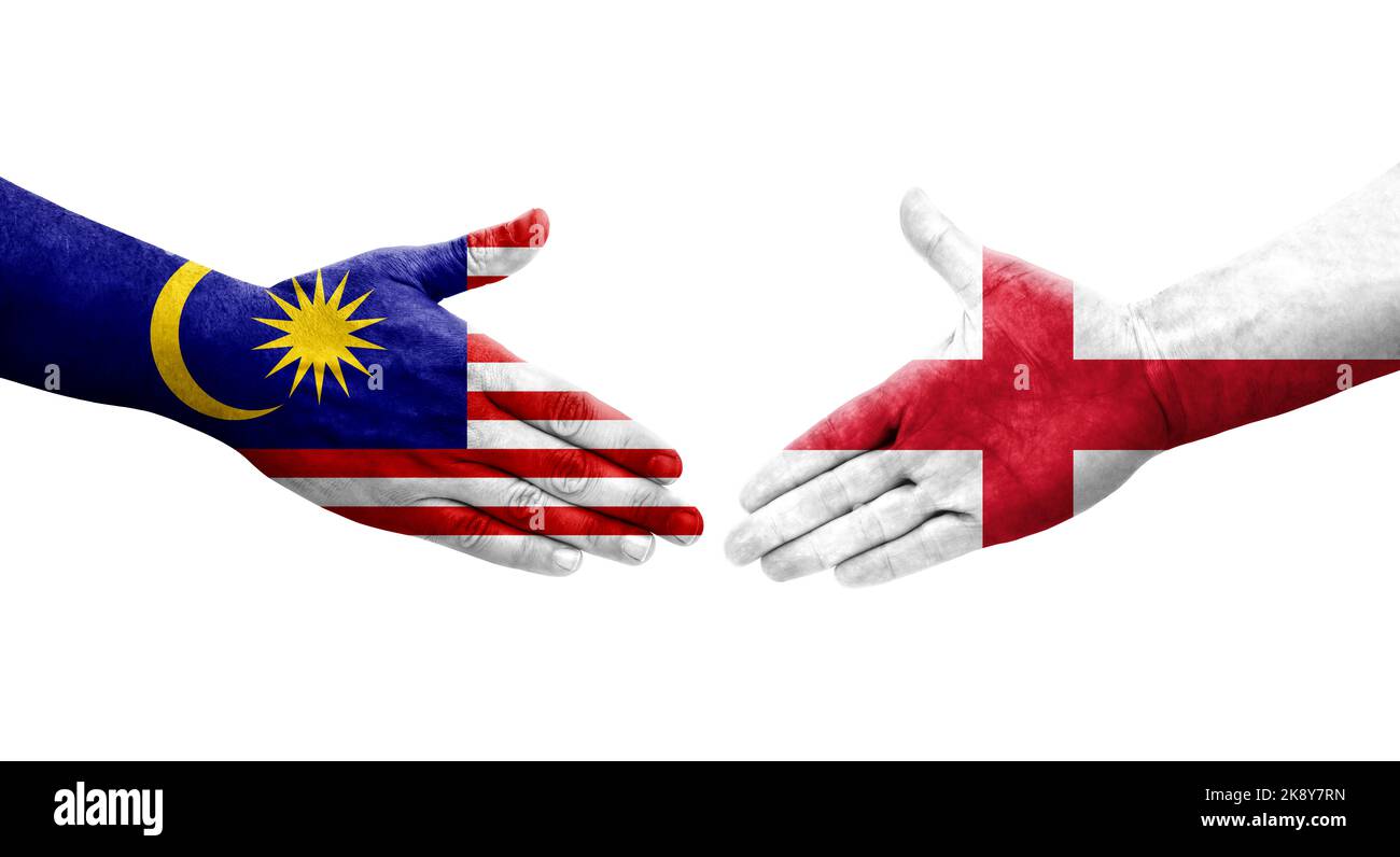 Handshake between England and Malaysia flags painted on hands, isolated ...