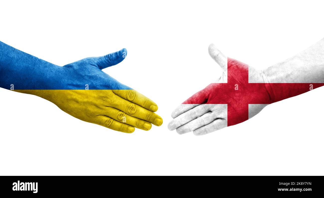 Handshake between England and Ukraine flags painted on hands, isolated ...