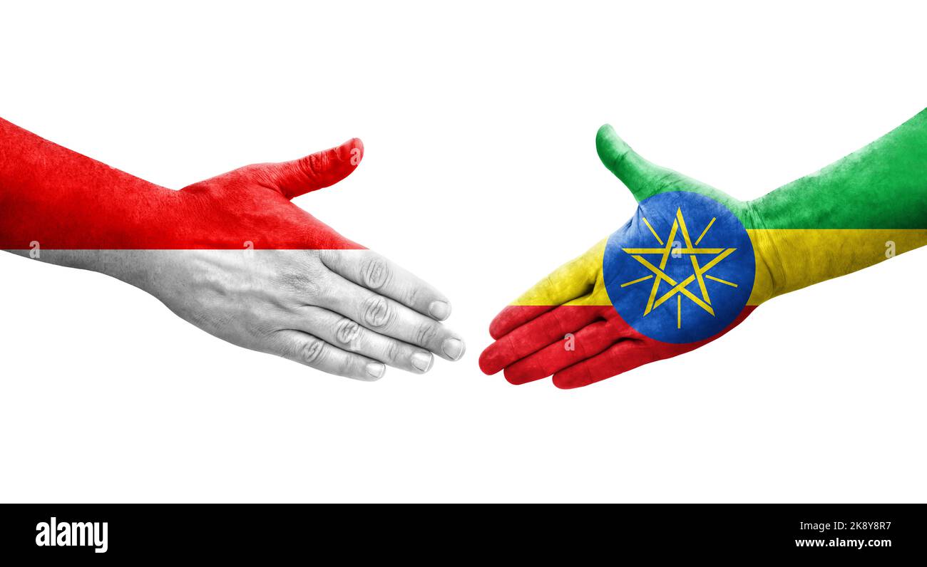 Handshake between Ethiopia and Indonesia flags painted on hands ...