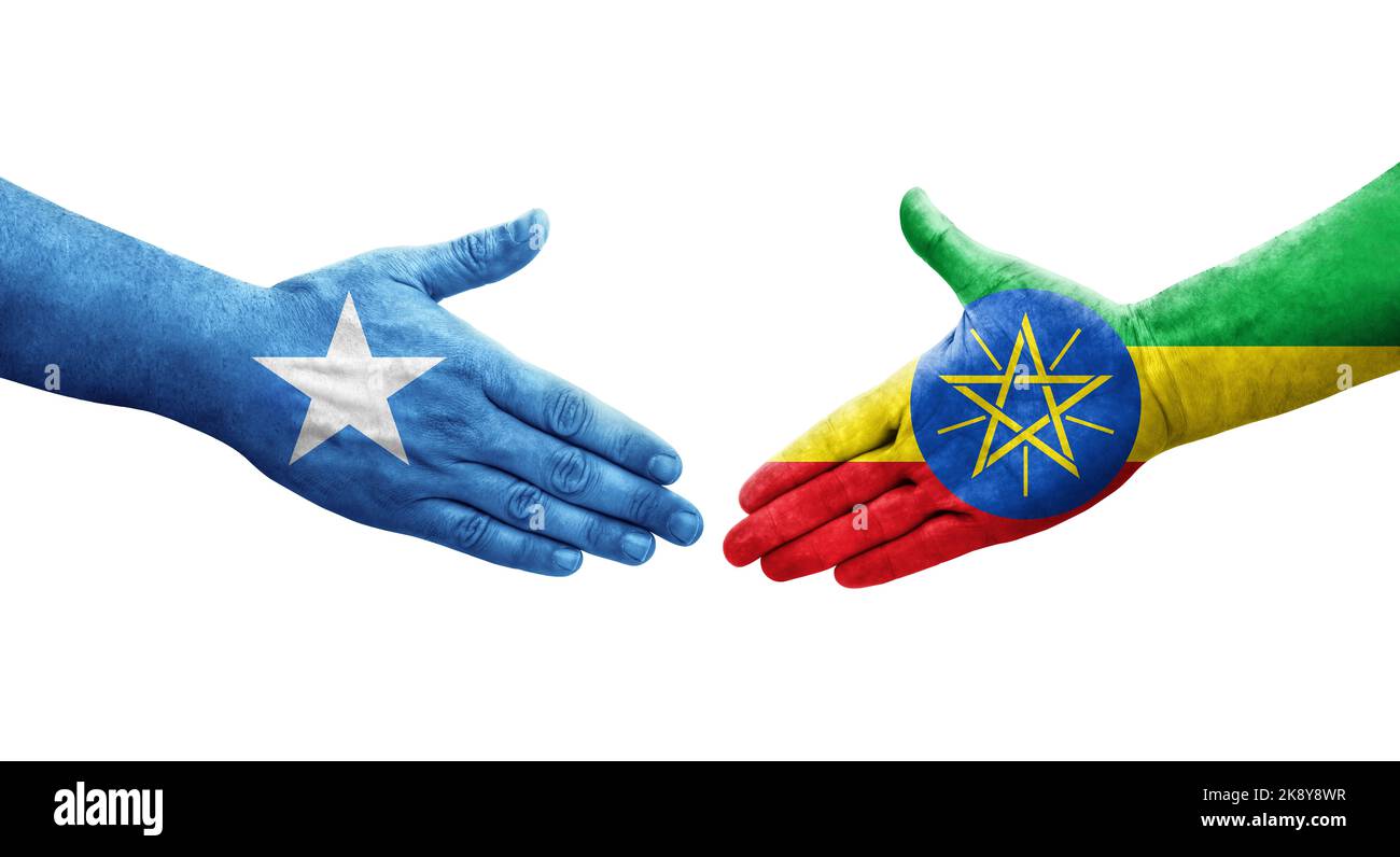 Handshake between Ethiopia and Somalia flags painted on hands, isolated ...