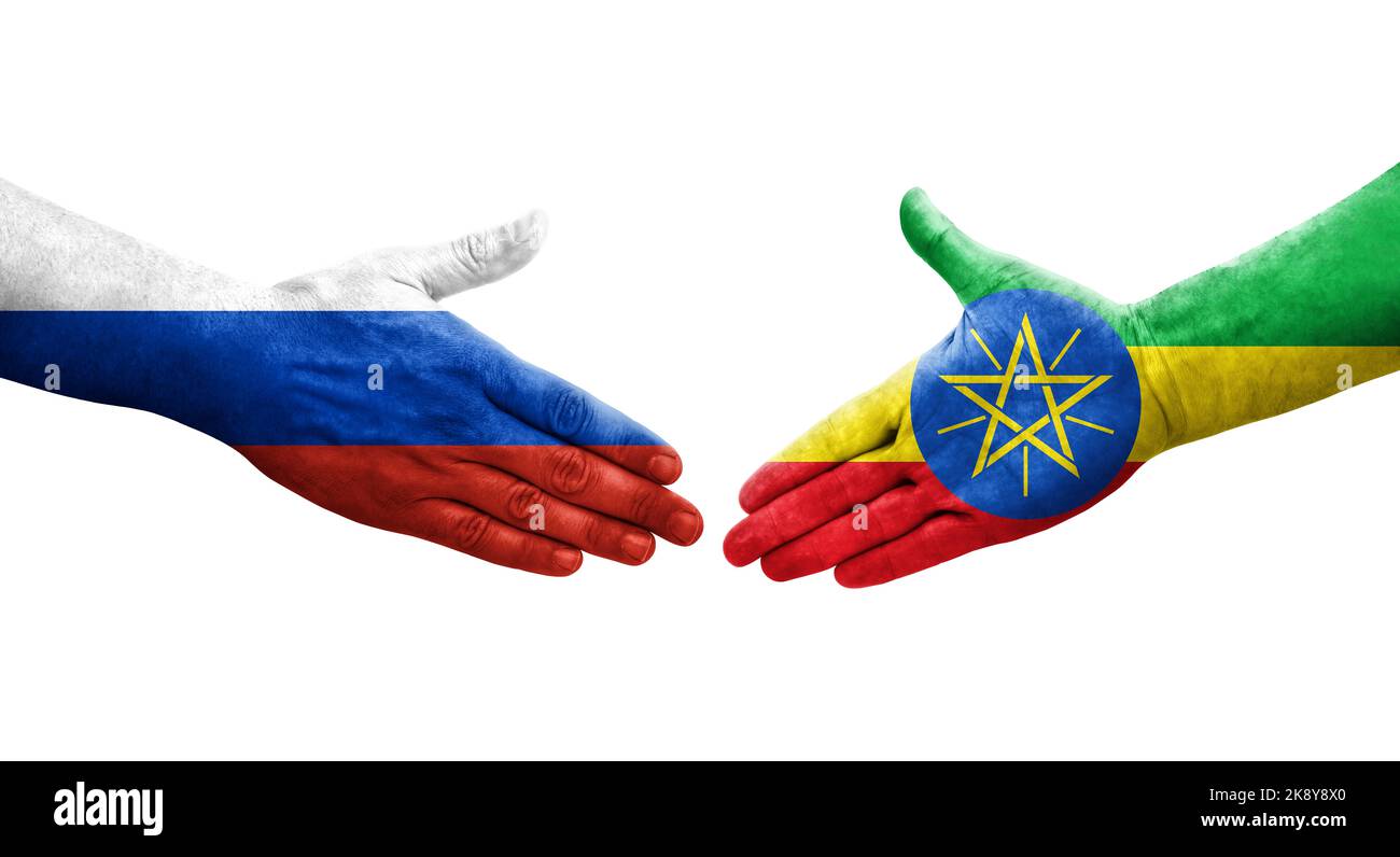Handshake between Ethiopia and Russia flags painted on hands, isolated ...