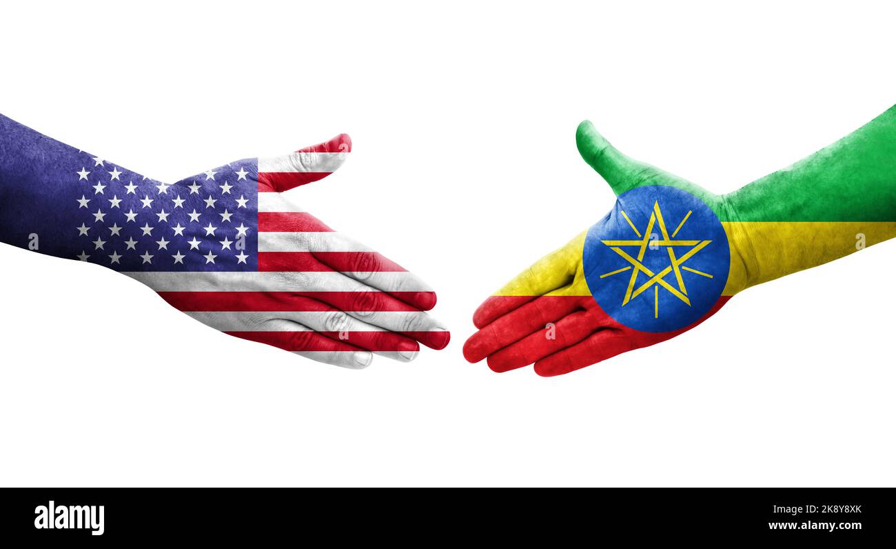 Handshake between Ethiopia and USA flags painted on hands, isolated ...