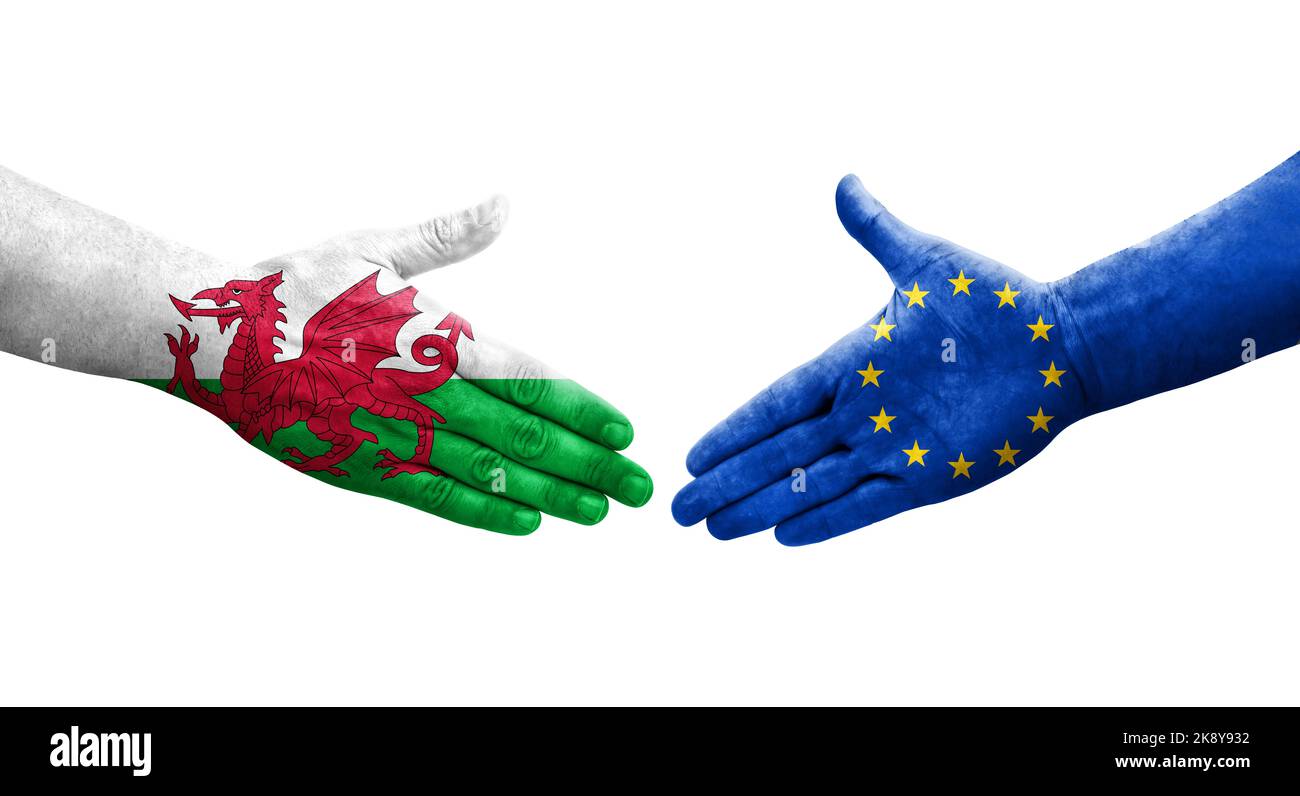 Handshake between European Union and Wales flags painted on hands ...