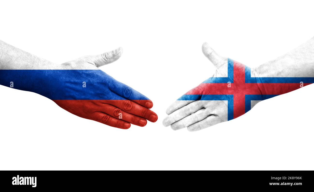 Handshake between Faroe Islands and Russia flags painted on hands ...