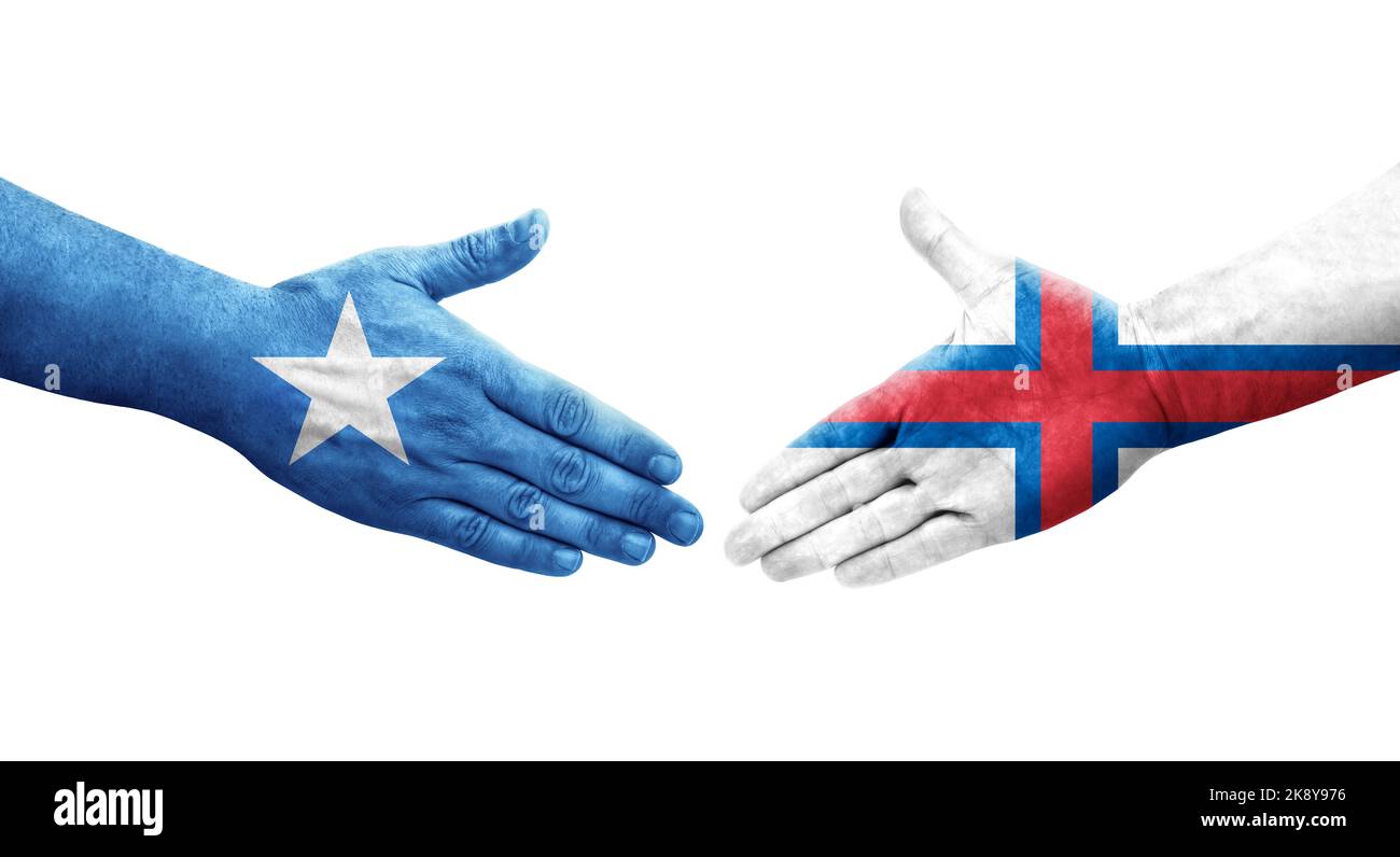 Handshake between Faroe Islands and Somalia flags painted on hands ...
