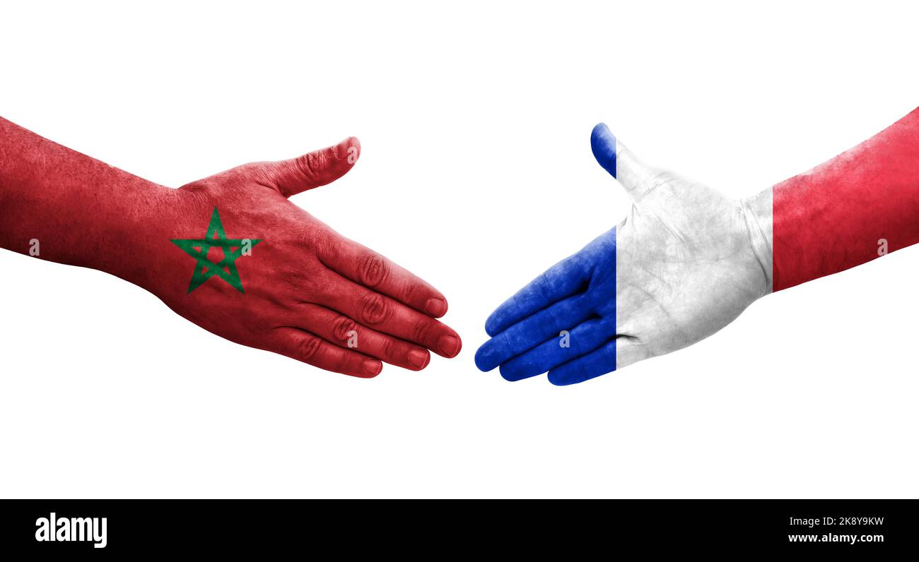 Handshake between France and Morocco flags painted on hands, isolated ...