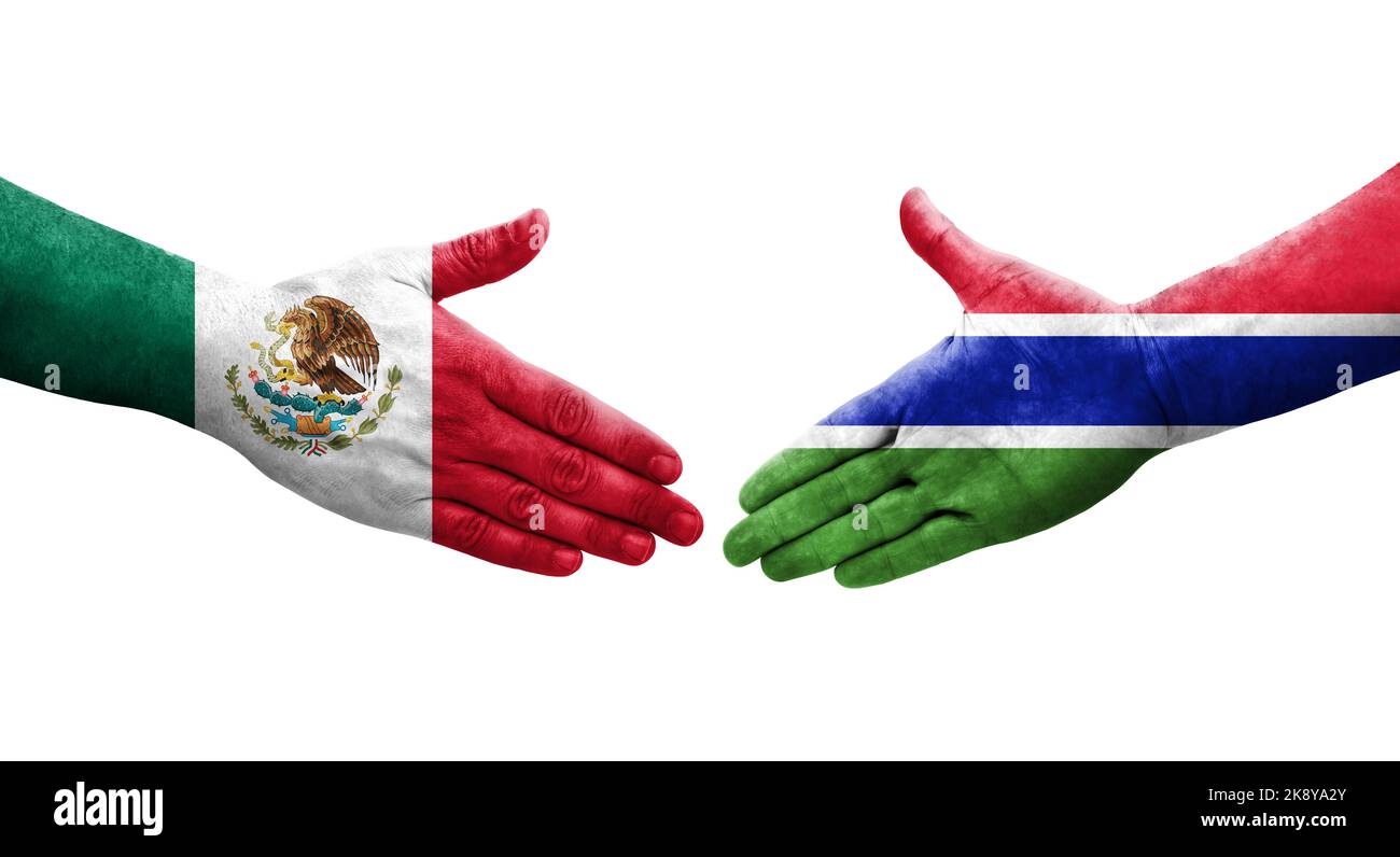 Handshake between Gambia and Mexico flags painted on hands, isolated ...