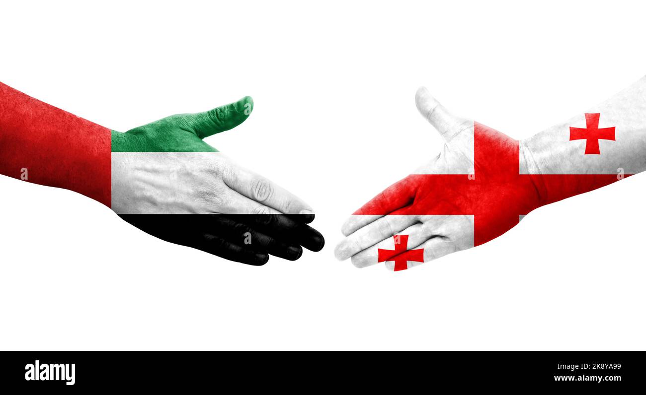 Handshake between Georgia and UAE flags painted on hands, isolated ...
