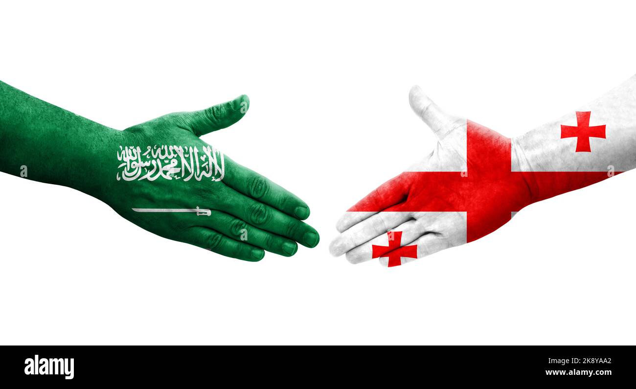 Handshake between Georgia and Saudi Arabia flags painted on hands ...