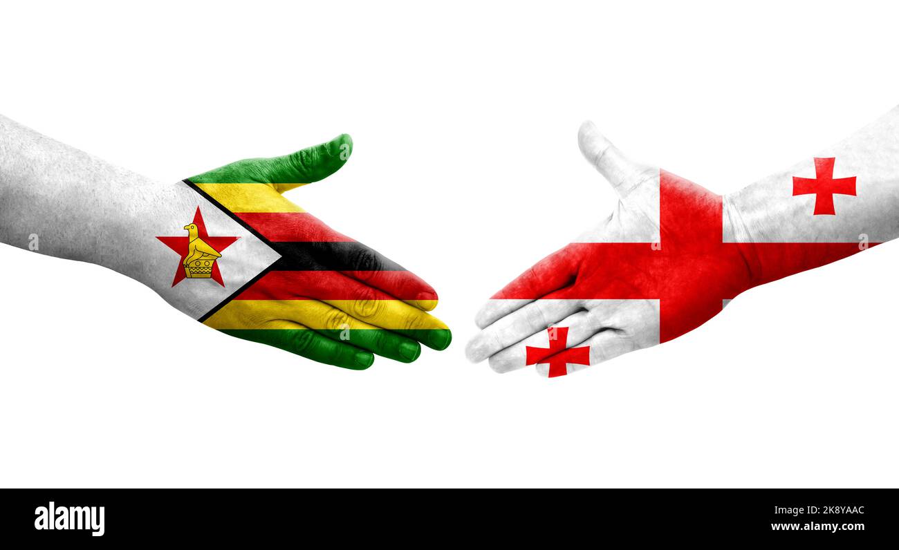 Handshake between Georgia and Zimbabwe flags painted on hands, isolated ...