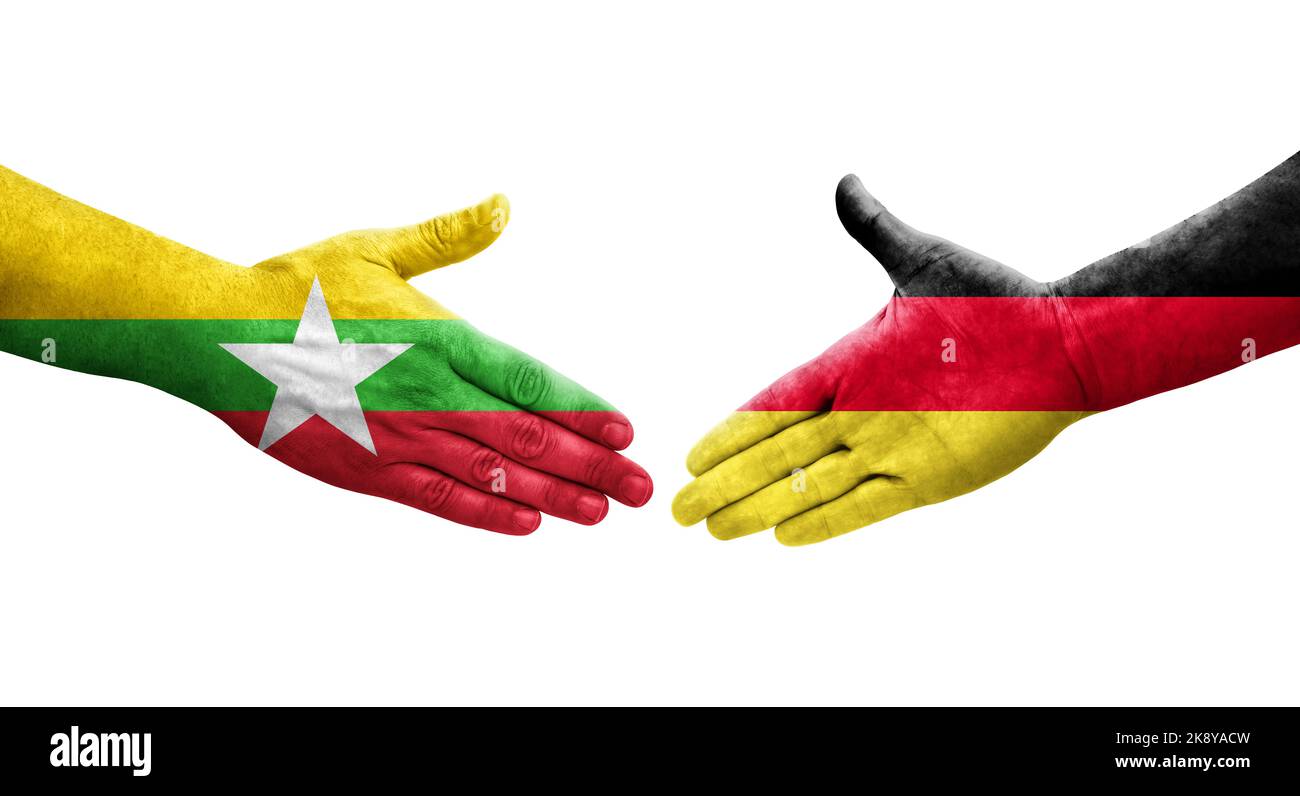 Handshake between Germany and Myanmar flags painted on hands, isolated ...