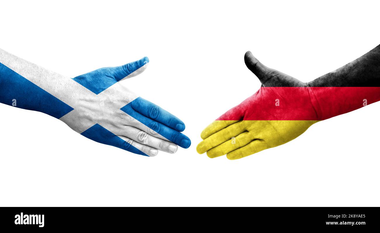 Handshake between Germany and Scotland flags painted on hands, isolated ...