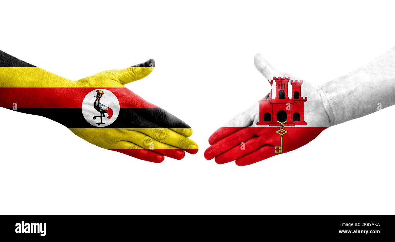Handshake between Ghana and Uganda flags painted on hands, isolated ...