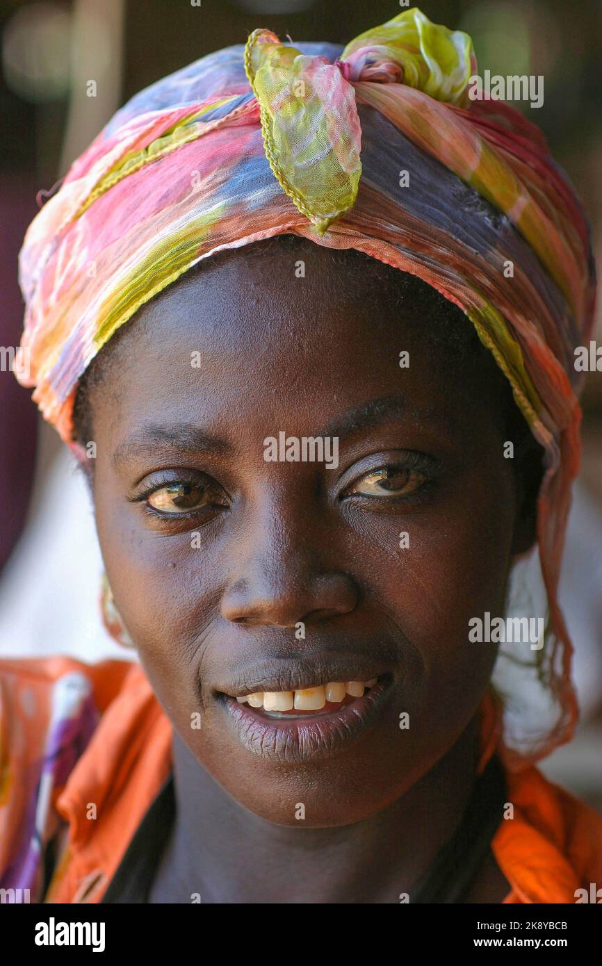 Ghana, Takoradi. Portrait of factory worker in a sawmill. The woman mainly sandpapers garden ...