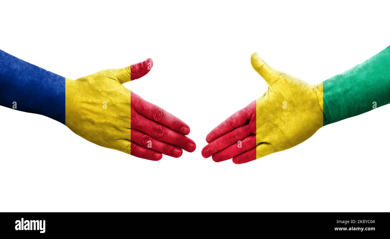 Handshake between Guinea and Romania flags painted on hands, isolated ...