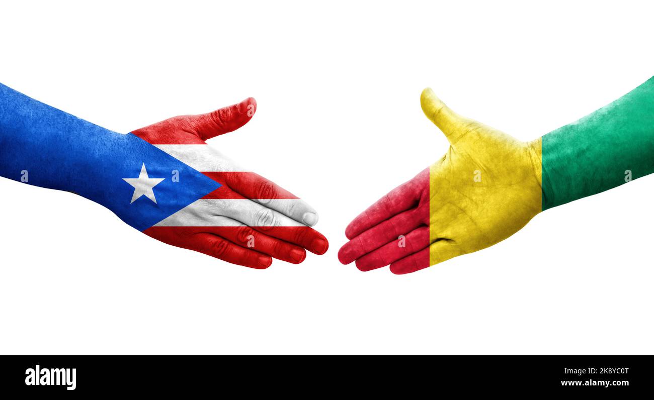 Handshake between Guinea and Puerto Rico flags painted on hands ...