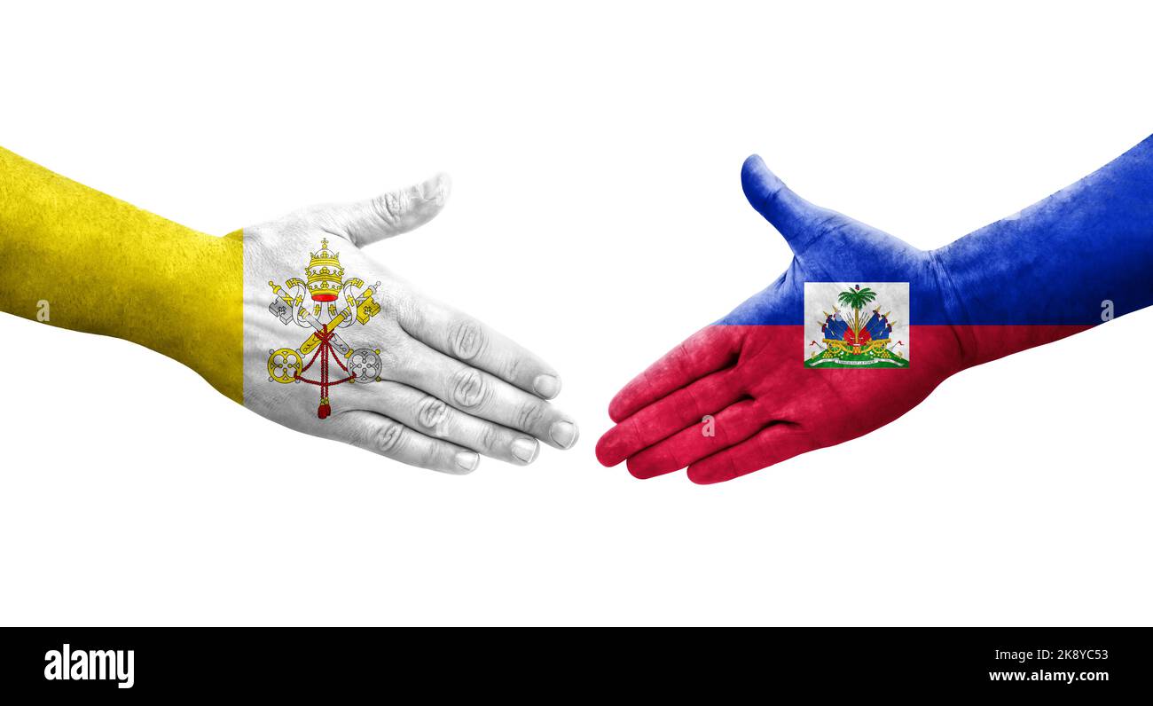 Handshake between Haiti and Holy See flags painted on hands, isolated ...