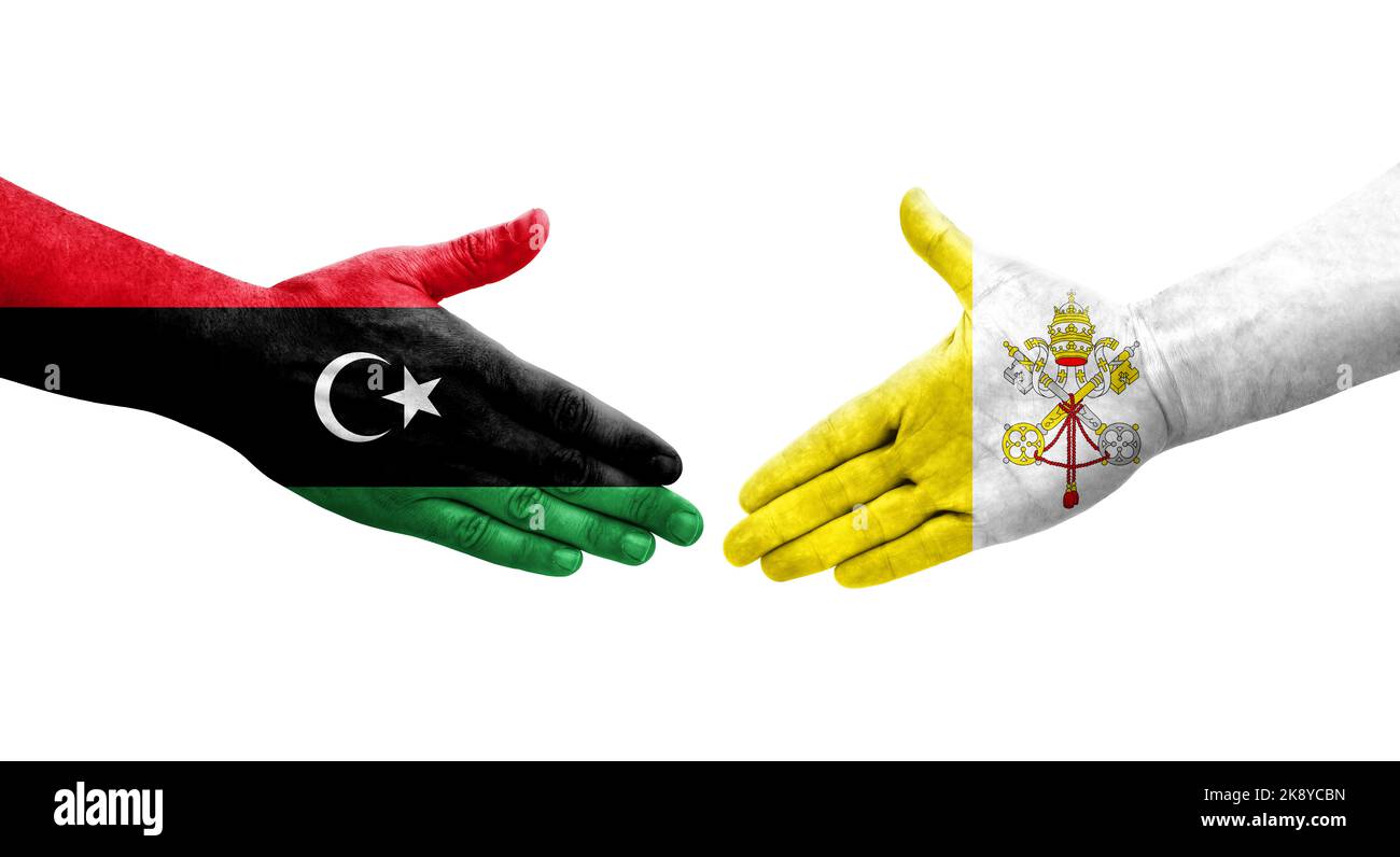 Handshake between Holy See and Libya flags painted on hands, isolated ...