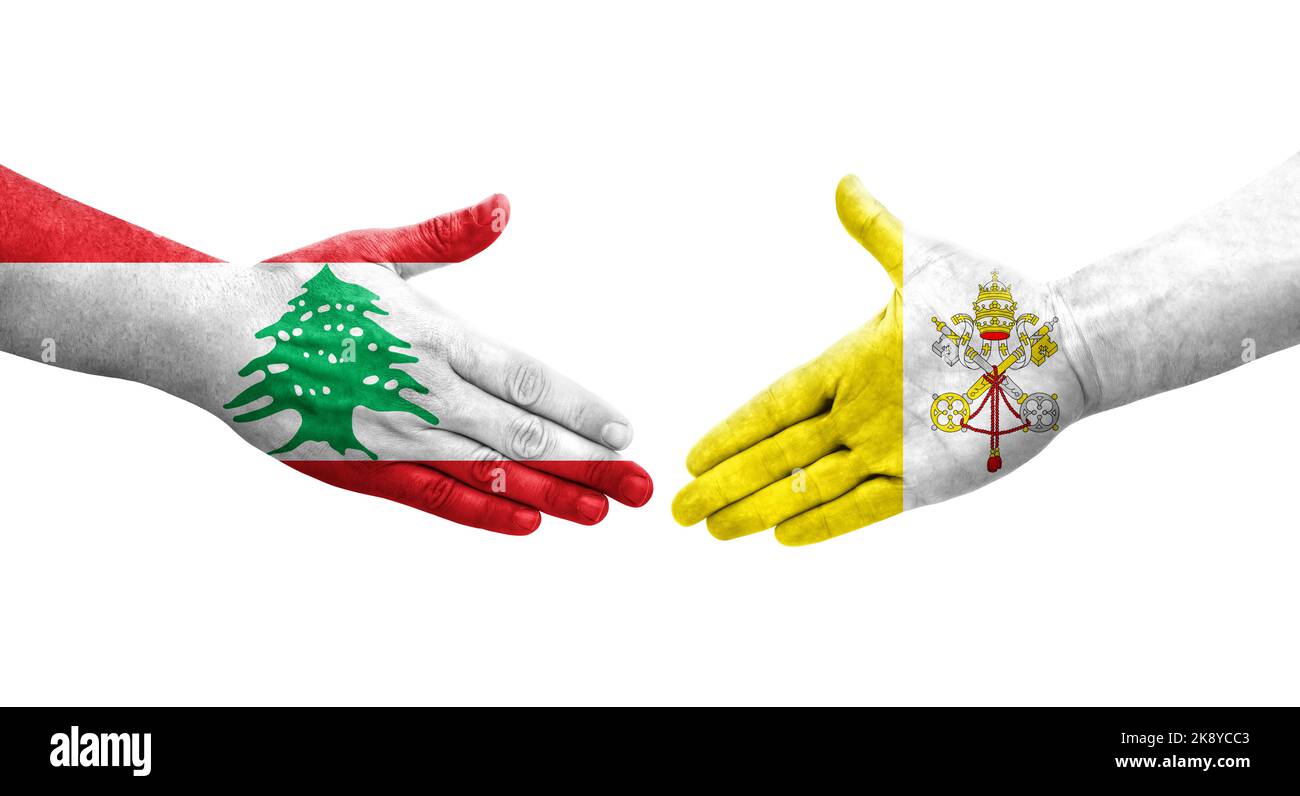 Handshake between Holy See and Lebanon flags painted on hands, isolated ...