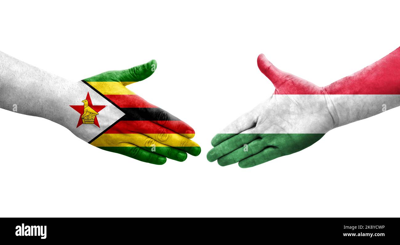 Handshake between Hungary and Zimbabwe flags painted on hands, isolated ...