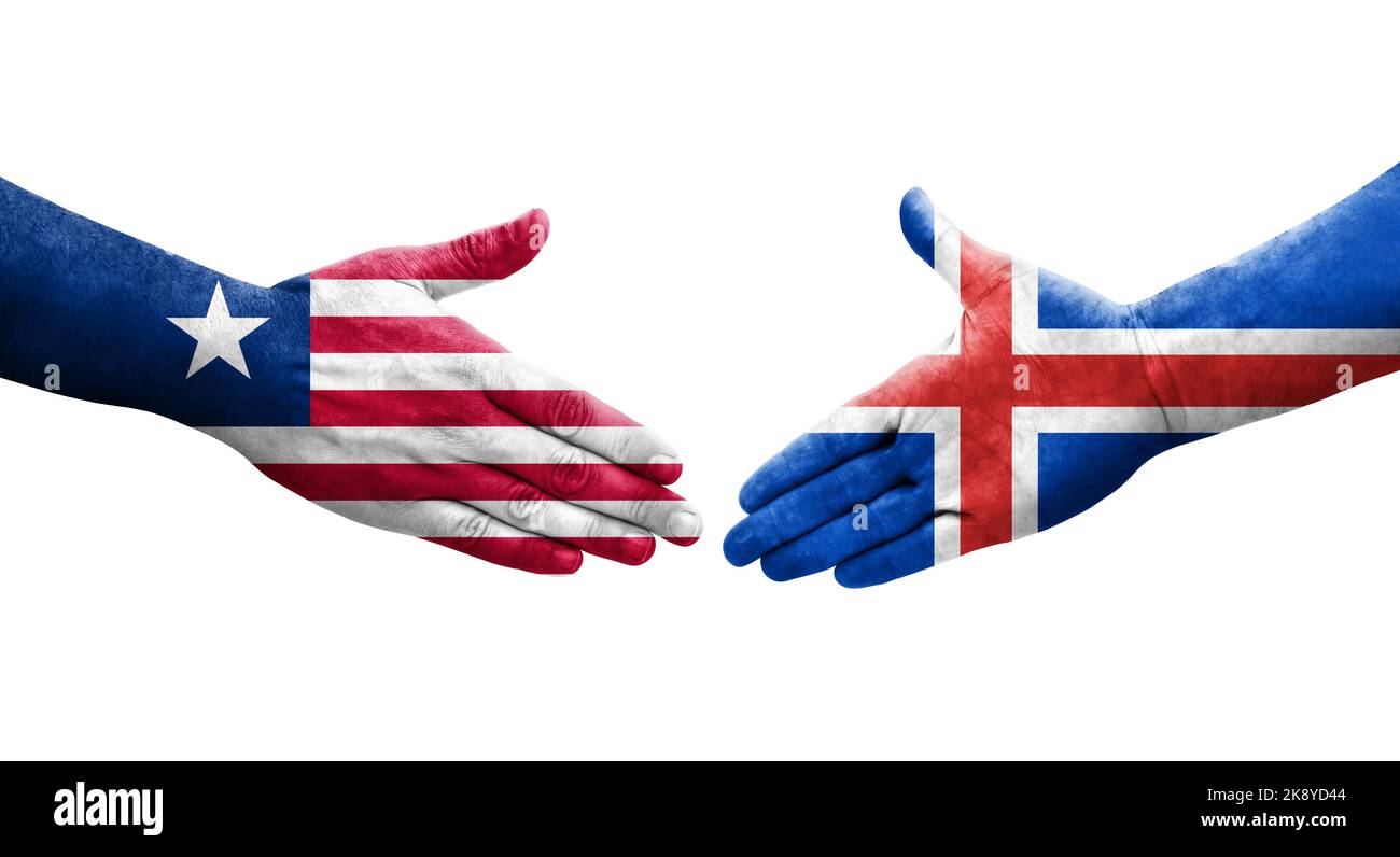 Handshake between Iceland and Liberia flags painted on hands, isolated ...