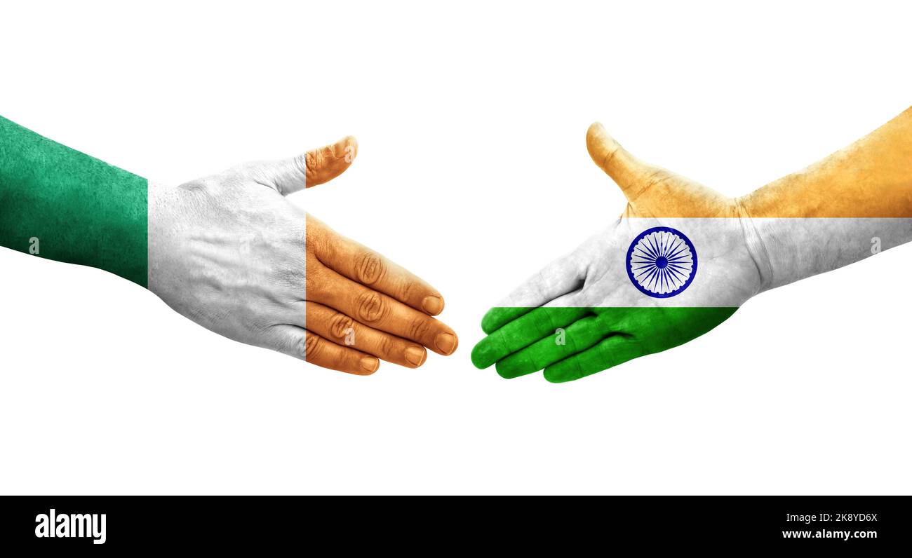 Handshake between India and Ireland flags painted on hands, isolated ...