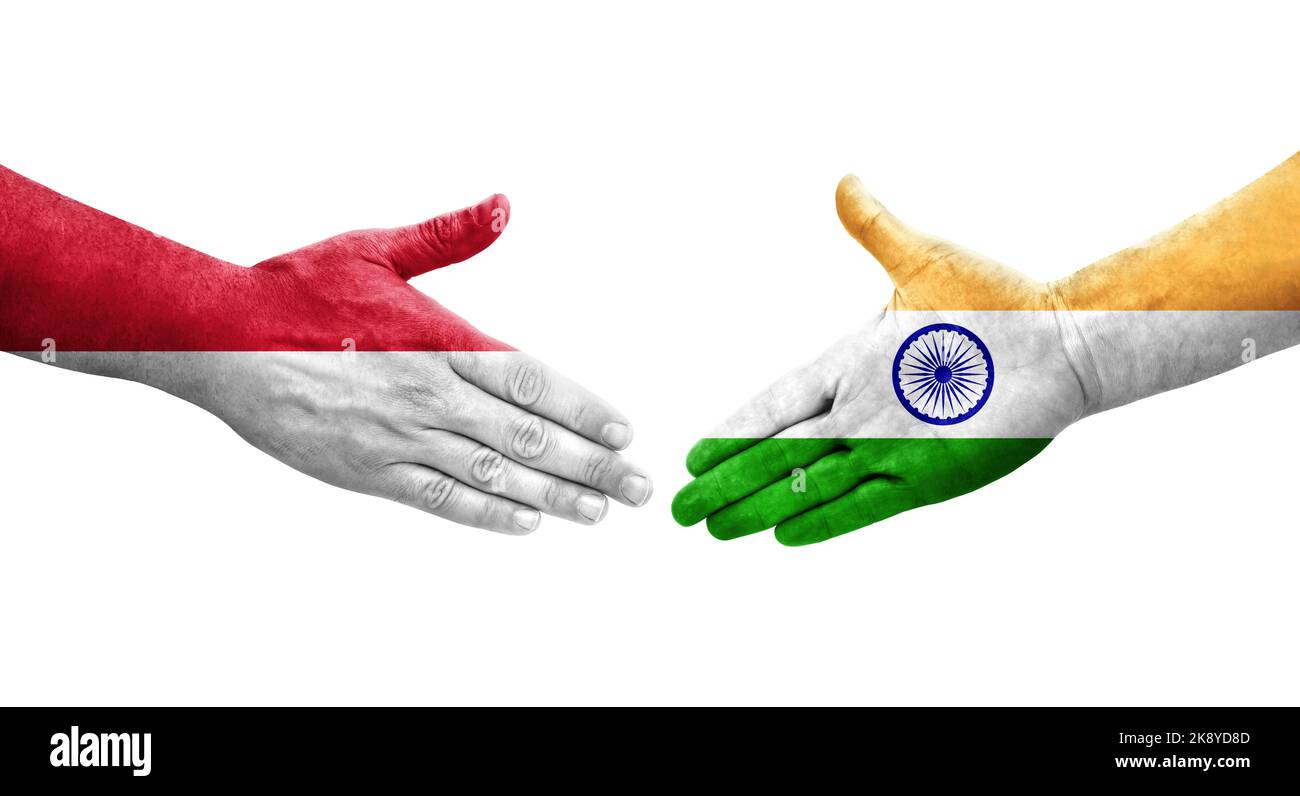 Handshake between India and Monaco flags painted on hands, isolated ...