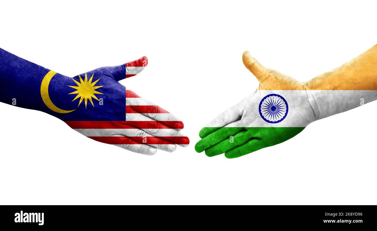 Handshake between India and Malaysia flags painted on hands, isolated ...