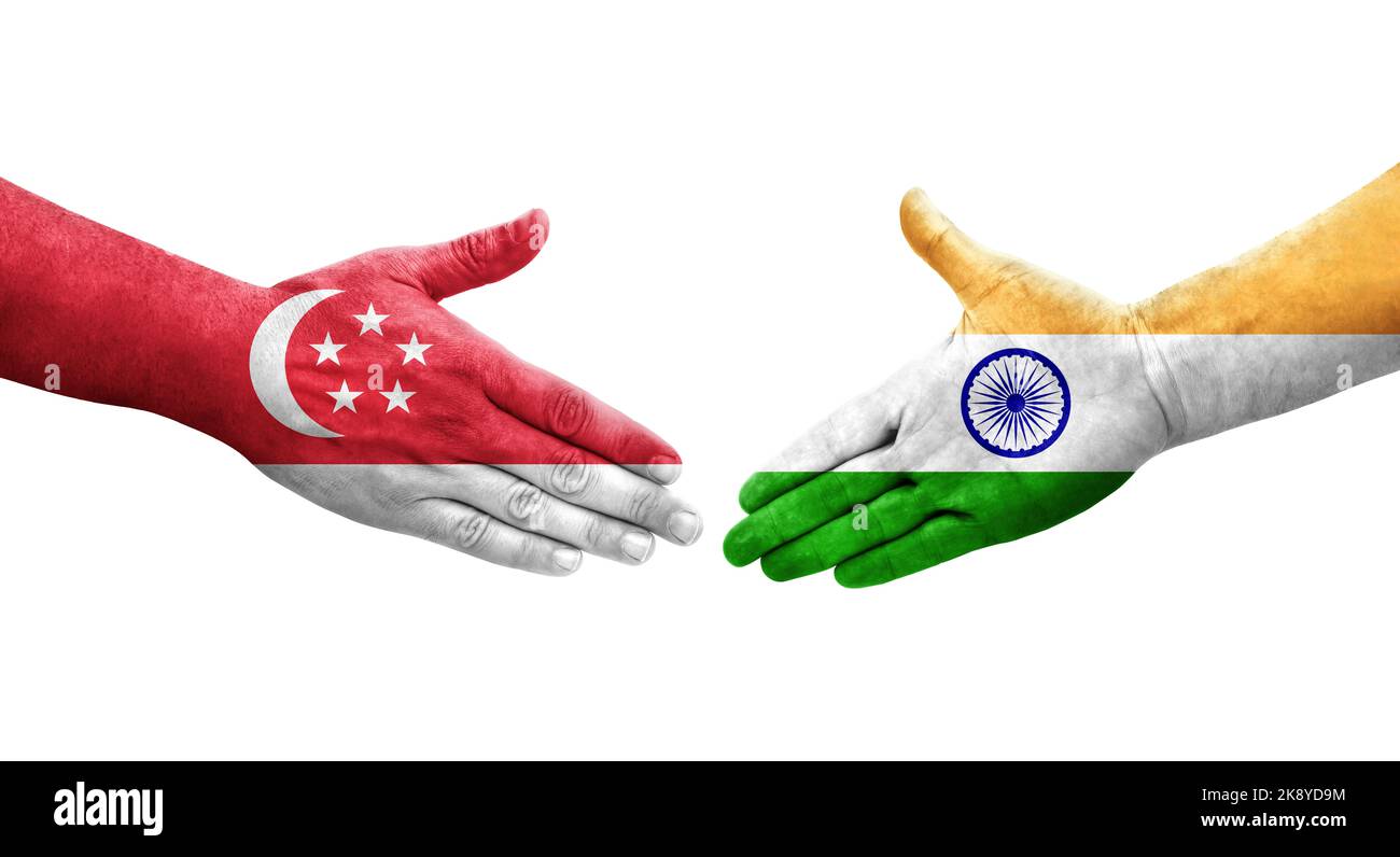 Handshake between India and Singapore flags painted on hands, isolated ...
