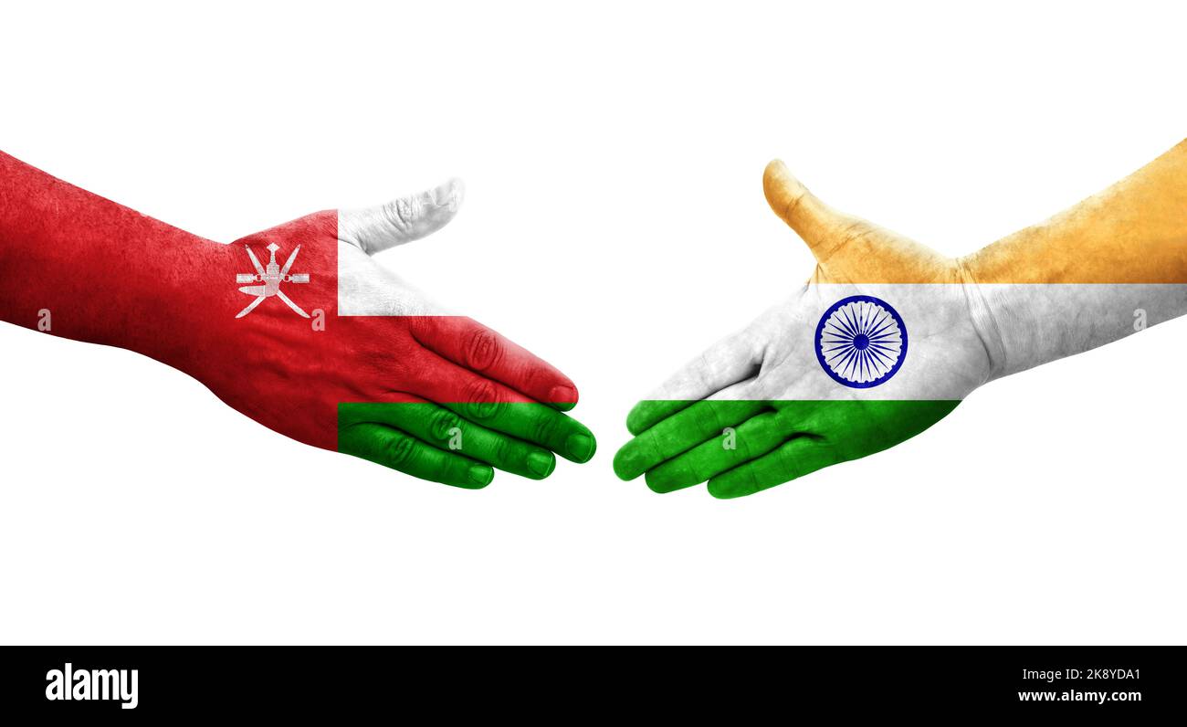 Handshake between India and Oman flags painted on hands, isolated ...