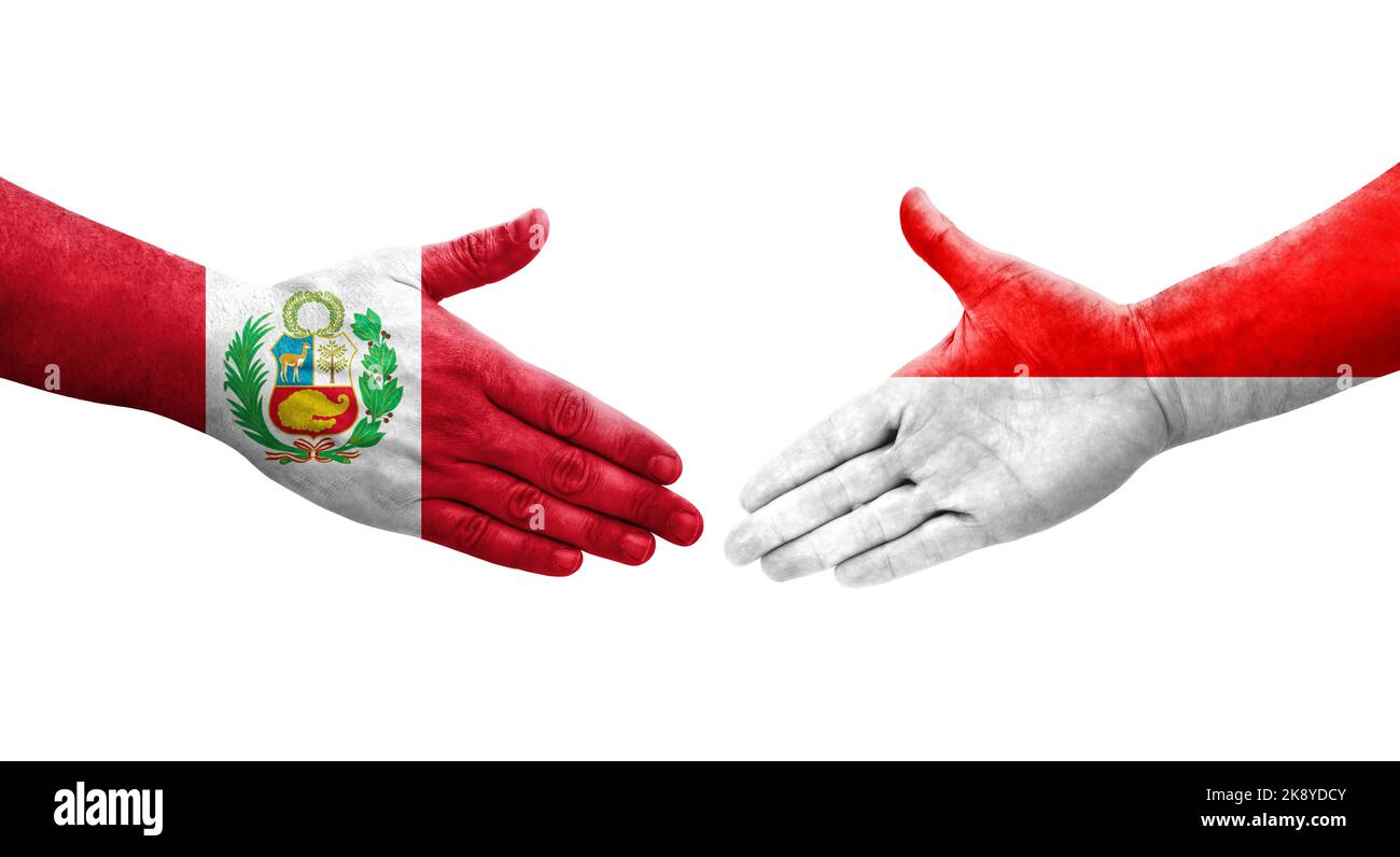 Handshake between Indonesia and Peru flags painted on hands, isolated ...