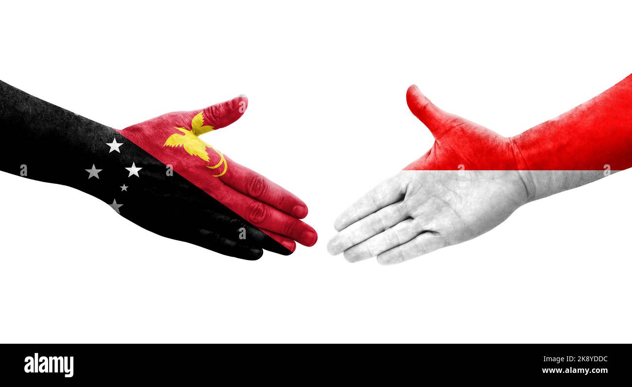 Handshake between Indonesia and Papua New Guinea flags painted on hands ...