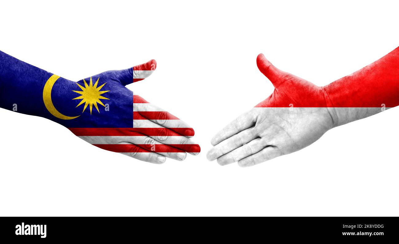 Handshake between Indonesia and Malaysia flags painted on hands ...