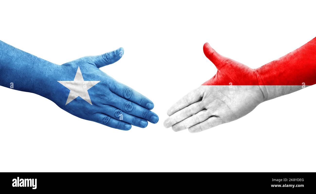 Handshake between Indonesia and Somalia flags painted on hands ...