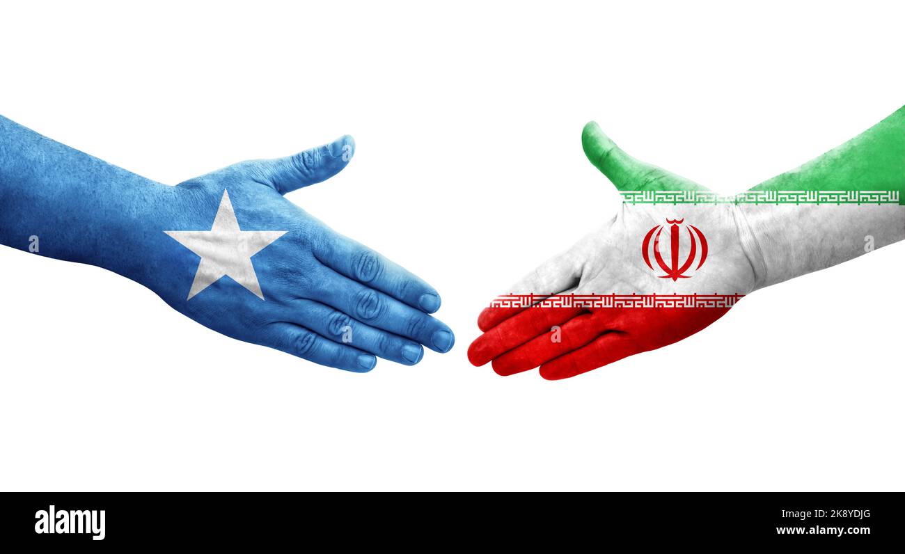 Handshake between Iran and Somalia flags painted on hands, isolated ...