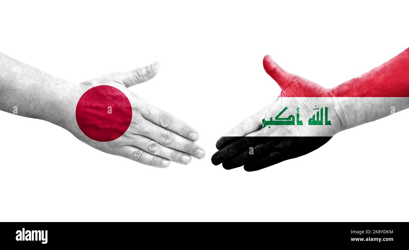 Handshake between Iraq and Japan flags painted on hands, isolated ...
