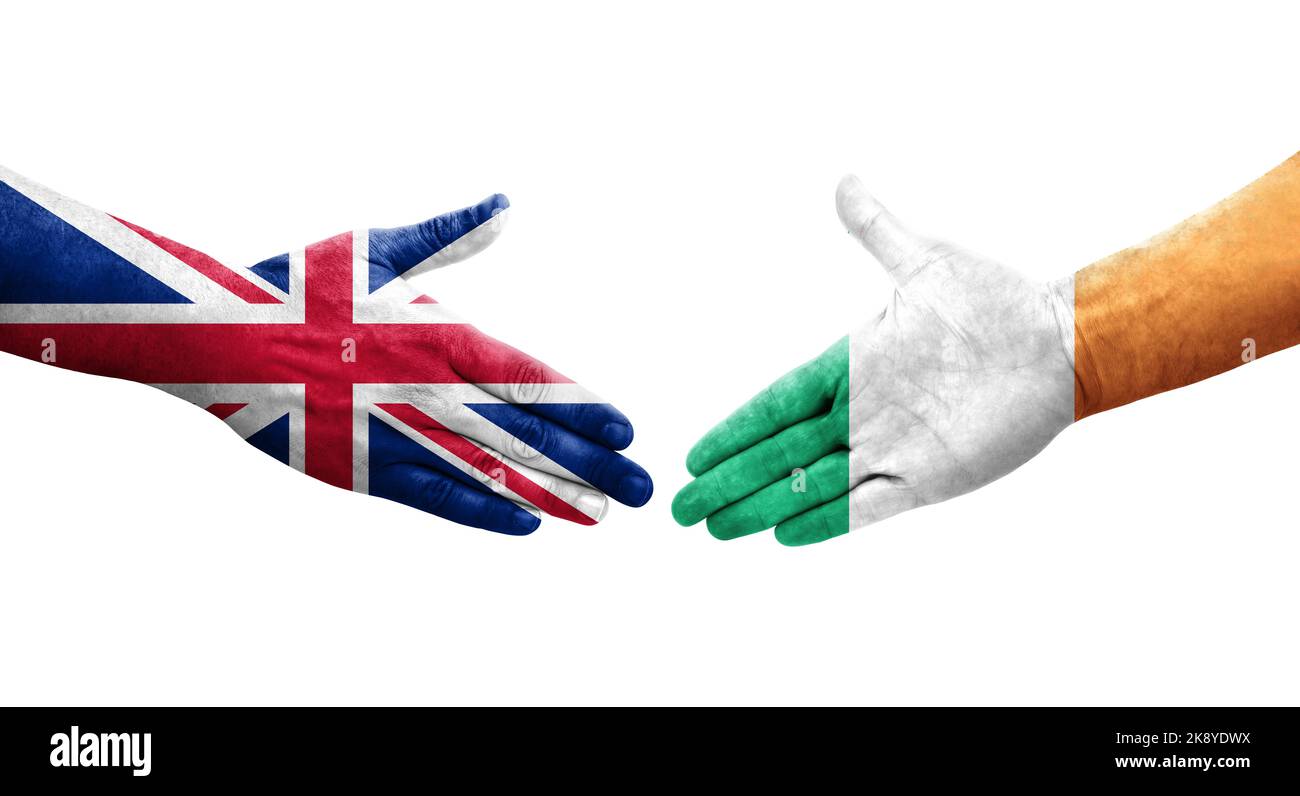 Handshake between Ireland and United Kingdom flags painted on hands ...