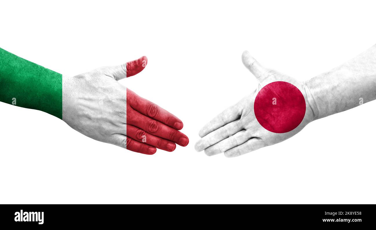 Handshake between Italy and Japan flags painted on hands, isolated ...