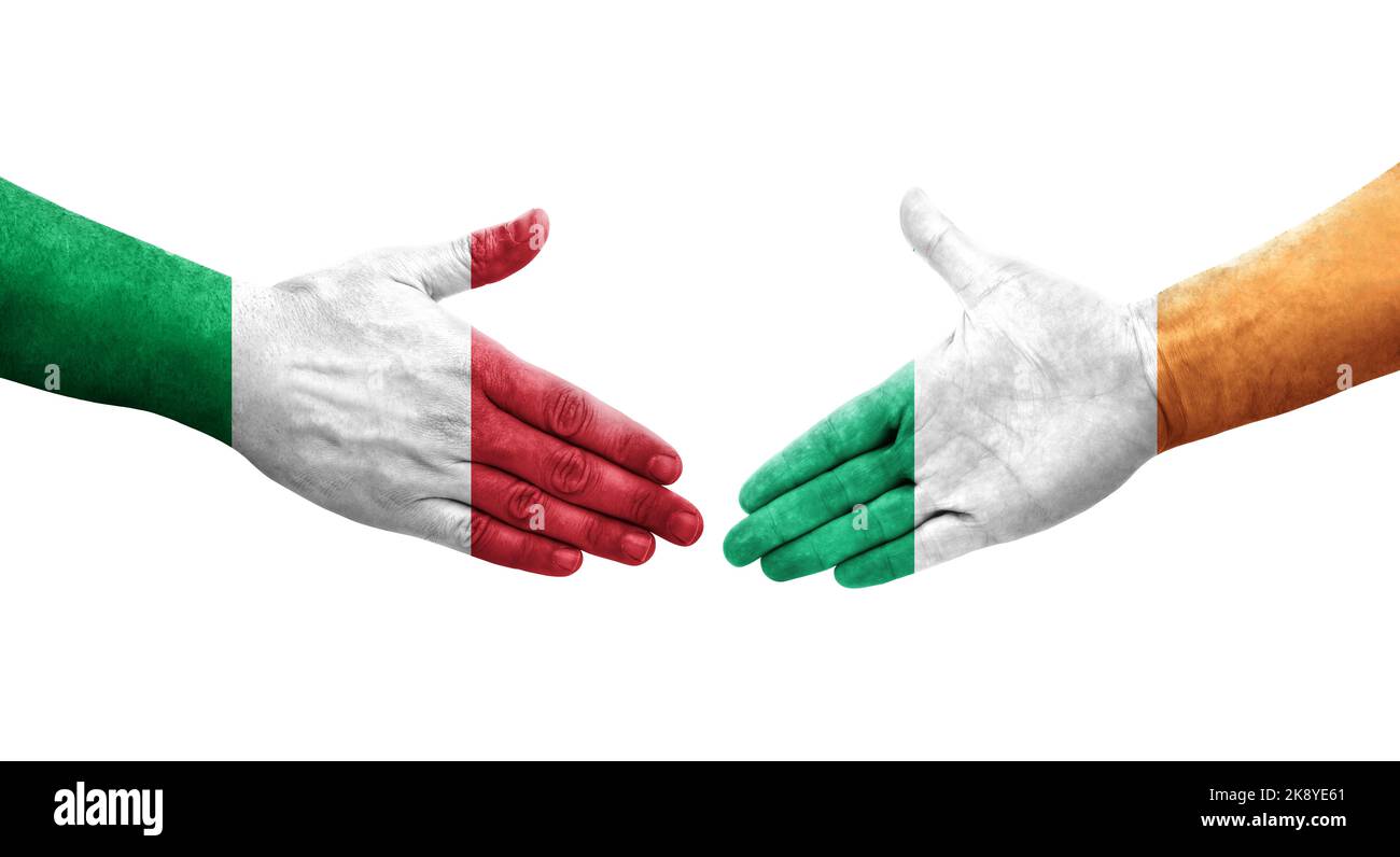 Handshake between Italy and Ireland flags painted on hands, isolated ...