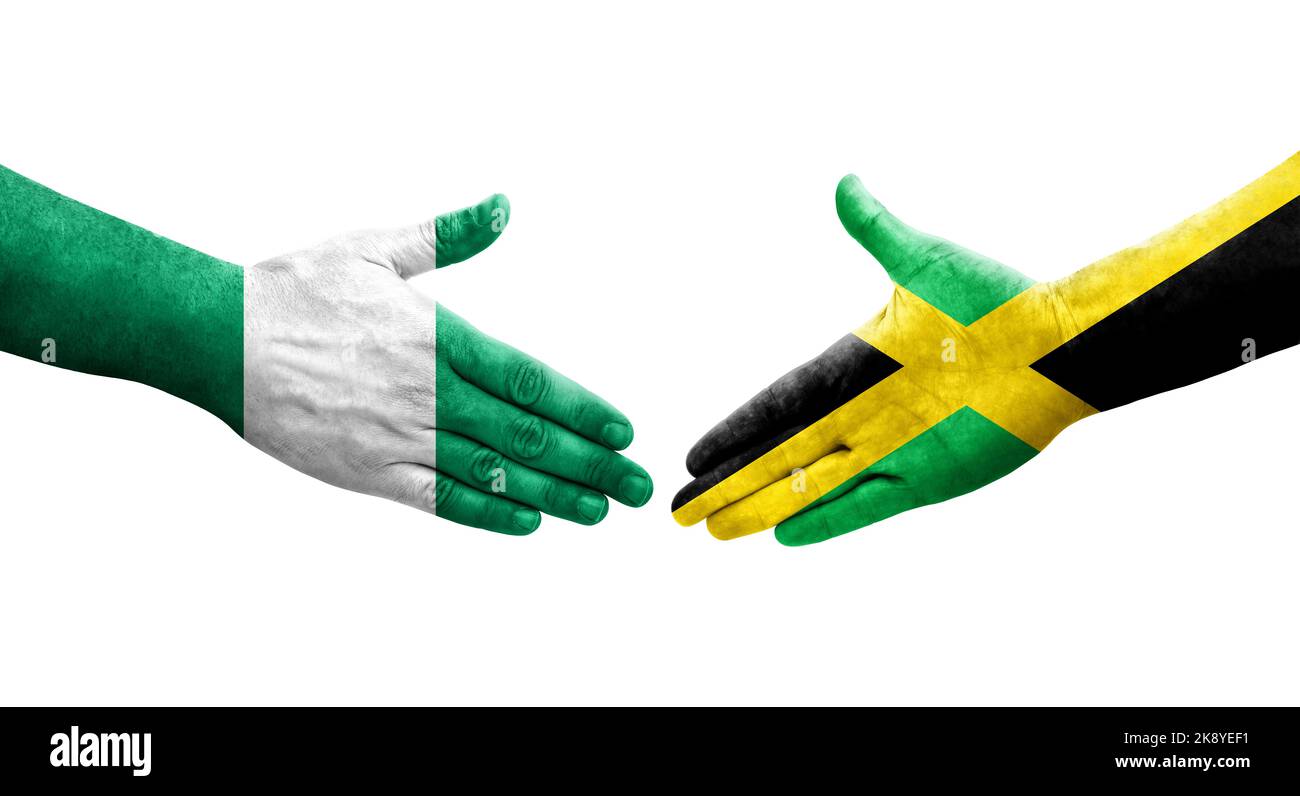 Handshake between Jamaica and Nigeria flags painted on hands, isolated ...
