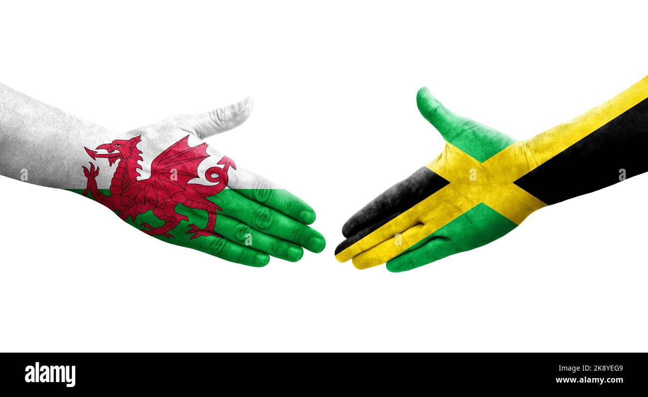 Handshake between Jamaica and Wales flags painted on hands, isolated ...