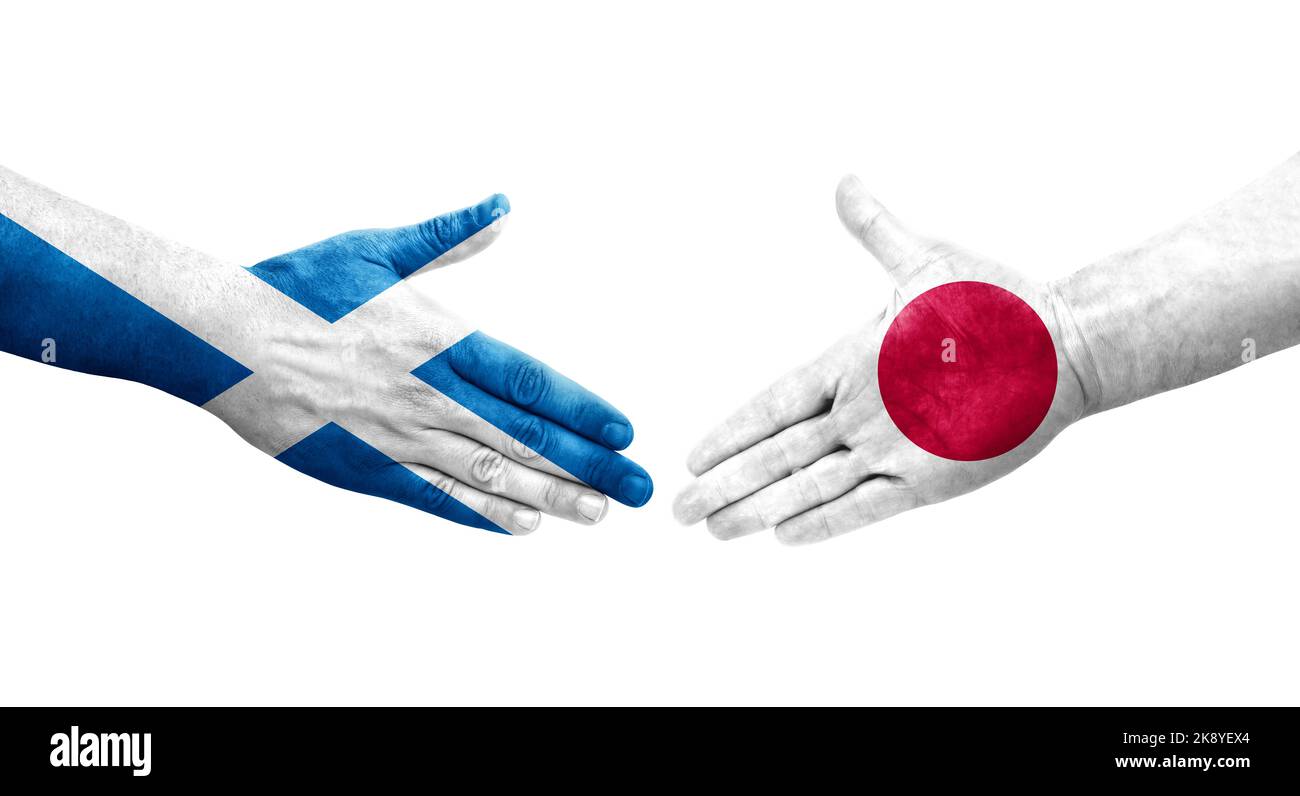 Handshake between Japan and Scotland flags painted on hands, isolated ...