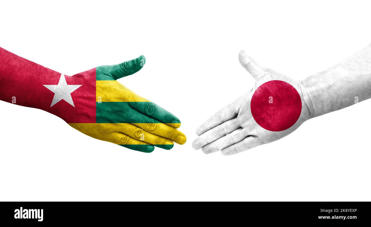 Handshake between Japan and Togo flags painted on hands, isolated ...